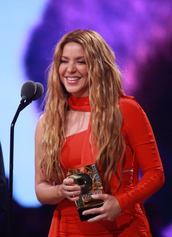 Shakira Shines in Red Mini Dress with Her Sons at Award-Winning Event